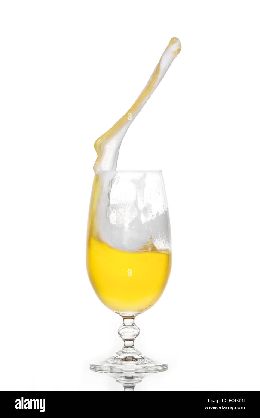 Splashing beer in a glass with little foam Stock Photo - Alamy
