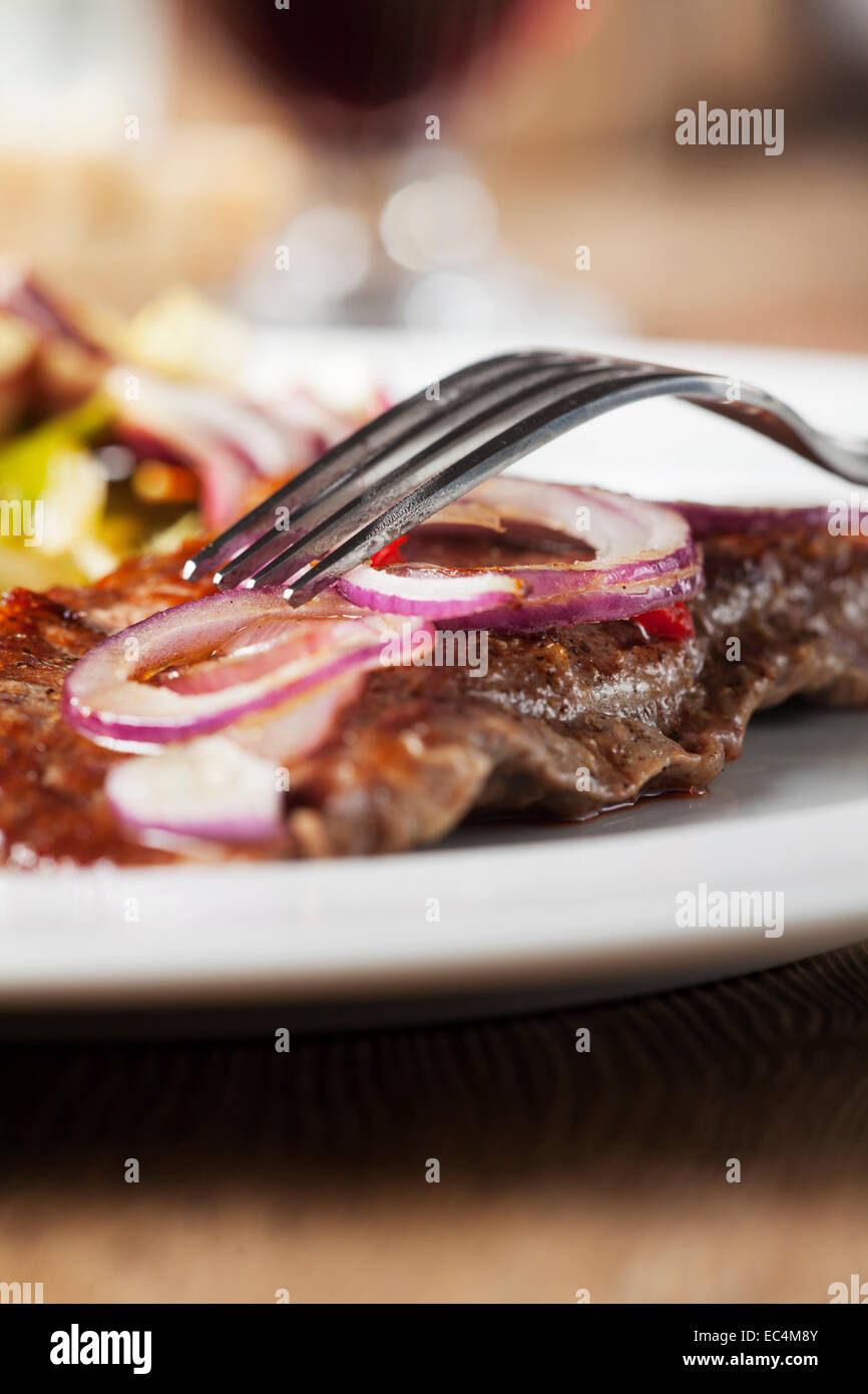 fork on steak Stock Photo - Alamy