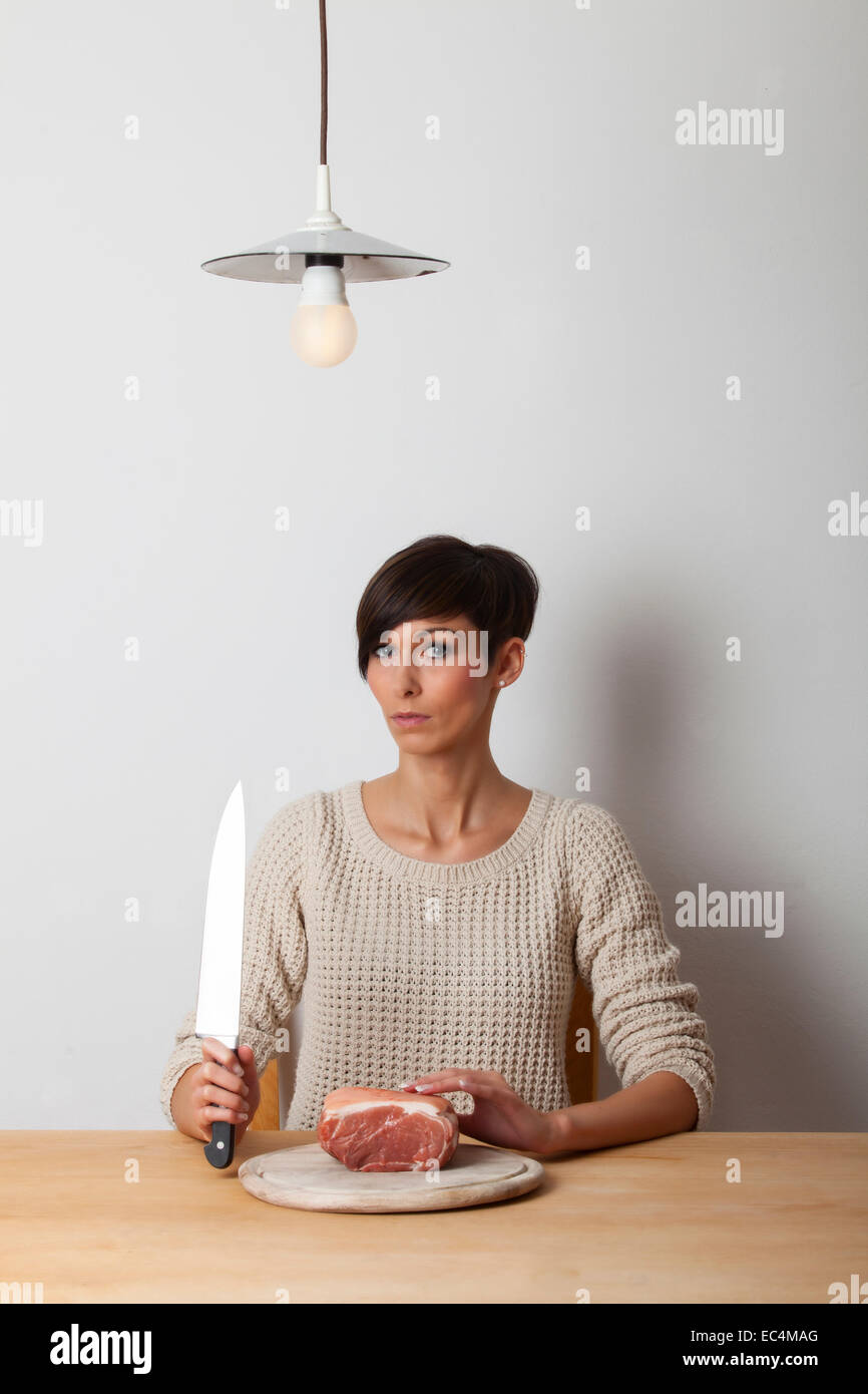 Woman and knife Stock Photo - Alamy