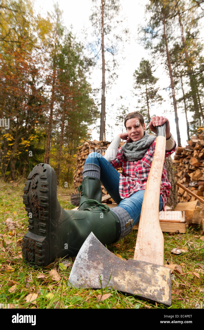 Attractive woman with axe Stock Photo - Alamy