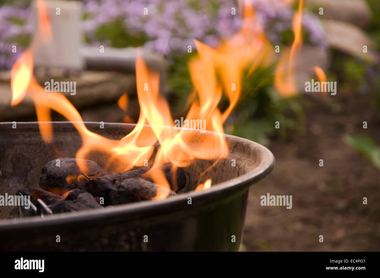 detail of starting barbeque with hot and high flames Stock Photo - Alamy