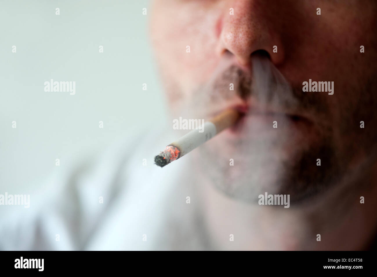 lower half of the face of a man with cigarette in mouth Stock Photo - Alamy