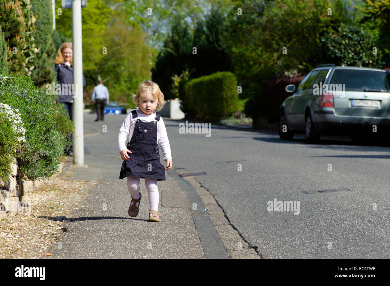 little girl running alone on the footpath Stock Photo - Alamy