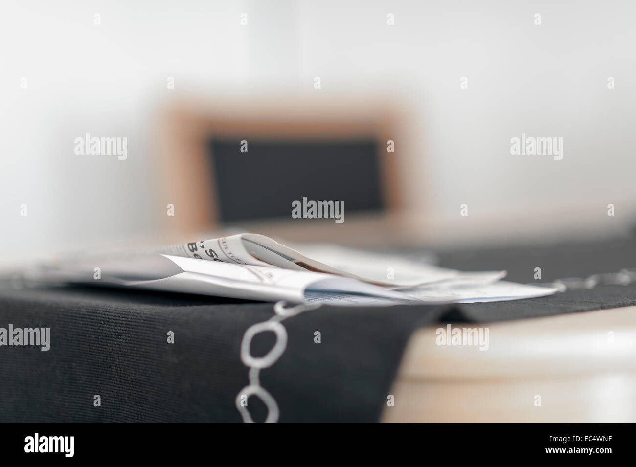 individual pages of a newspaper lying on a table Stock Photo - Alamy