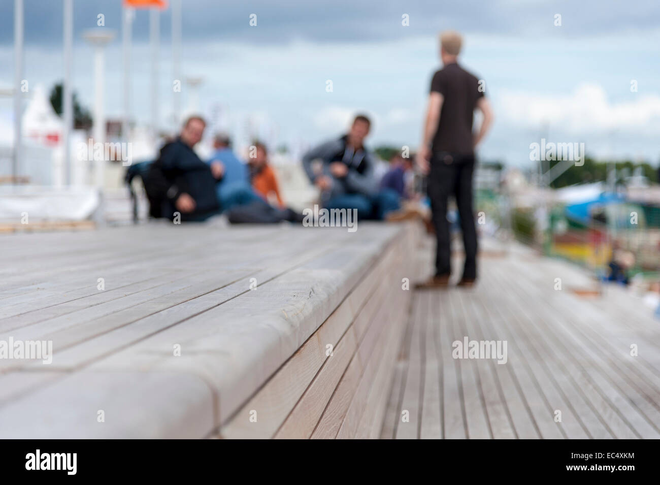 Group people sitting on benches hi-res stock photography and images - Alamy