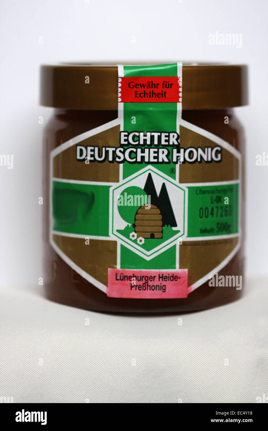 A glass of heather honey. Heather honey from straw baskets have to be ...