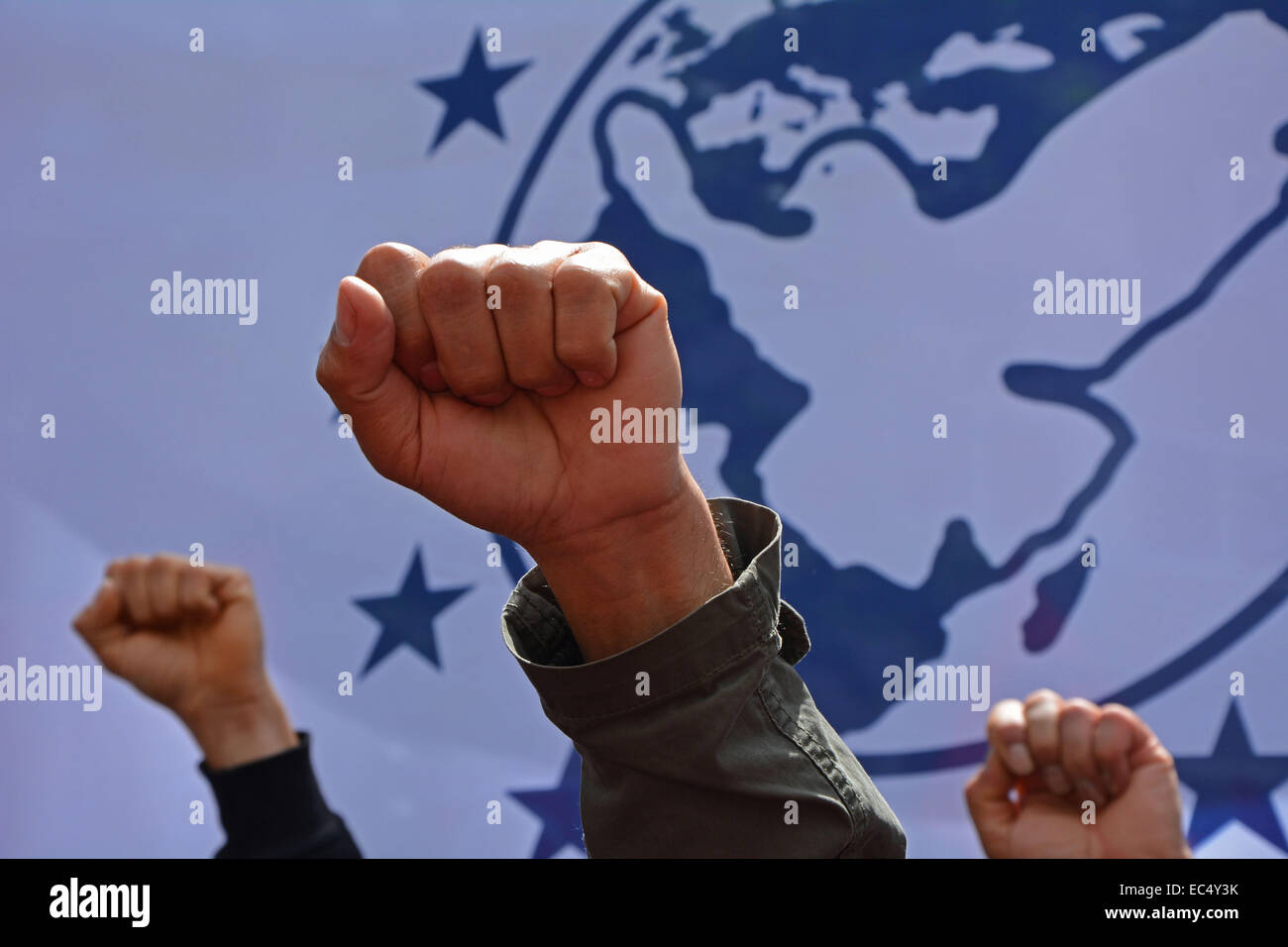 Clenched fists raised in protest Stock Photo - Alamy