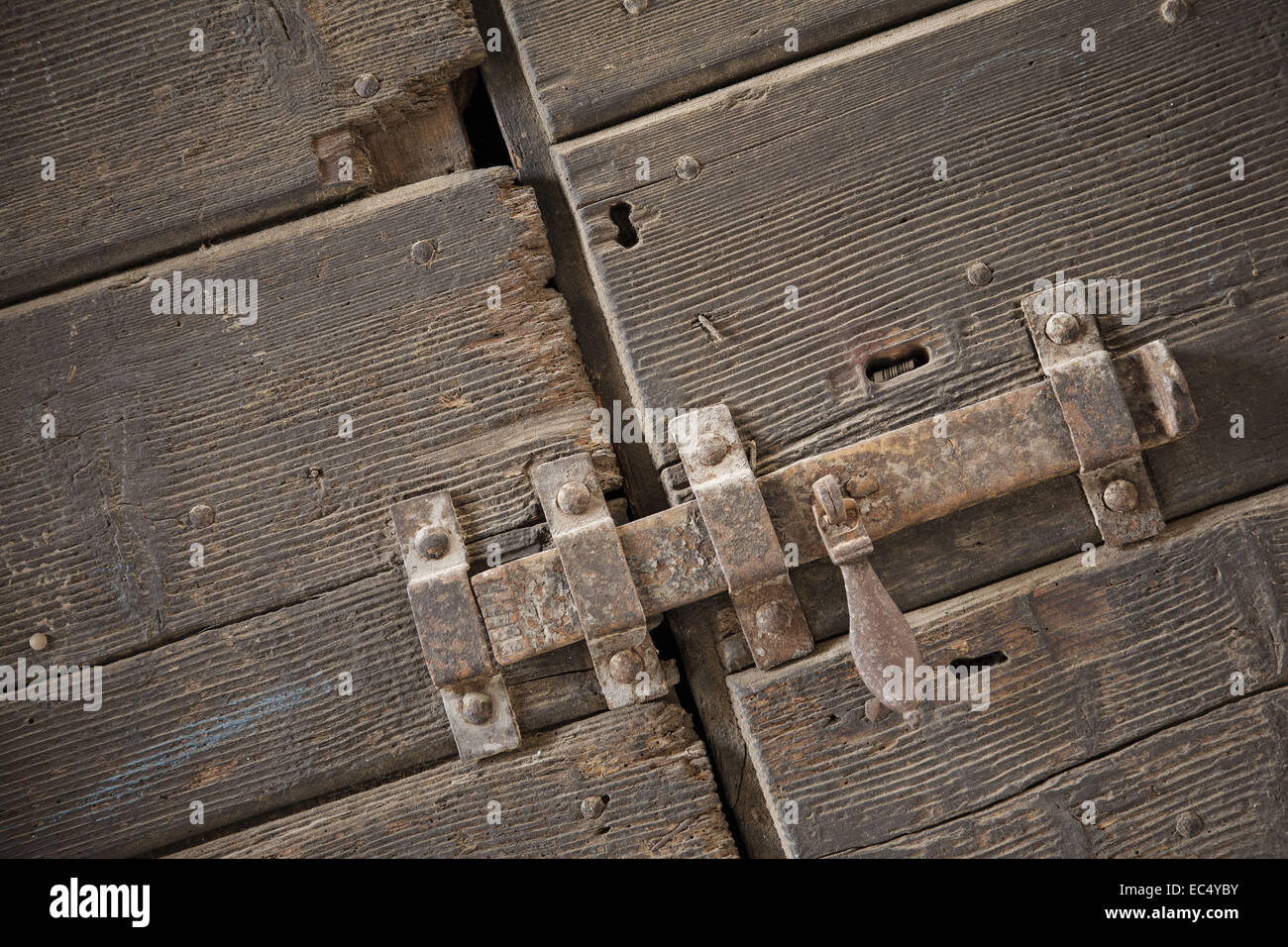 Massive latch on an old wooden door Stock Photo - Alamy