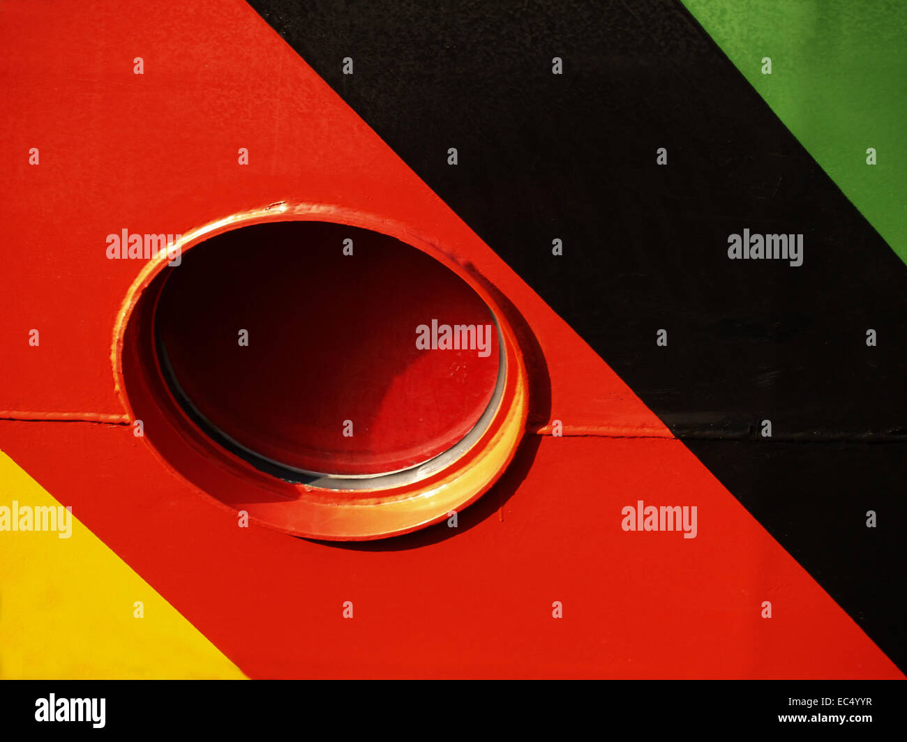 Striped shell plate with porthole Stock Photo - Alamy