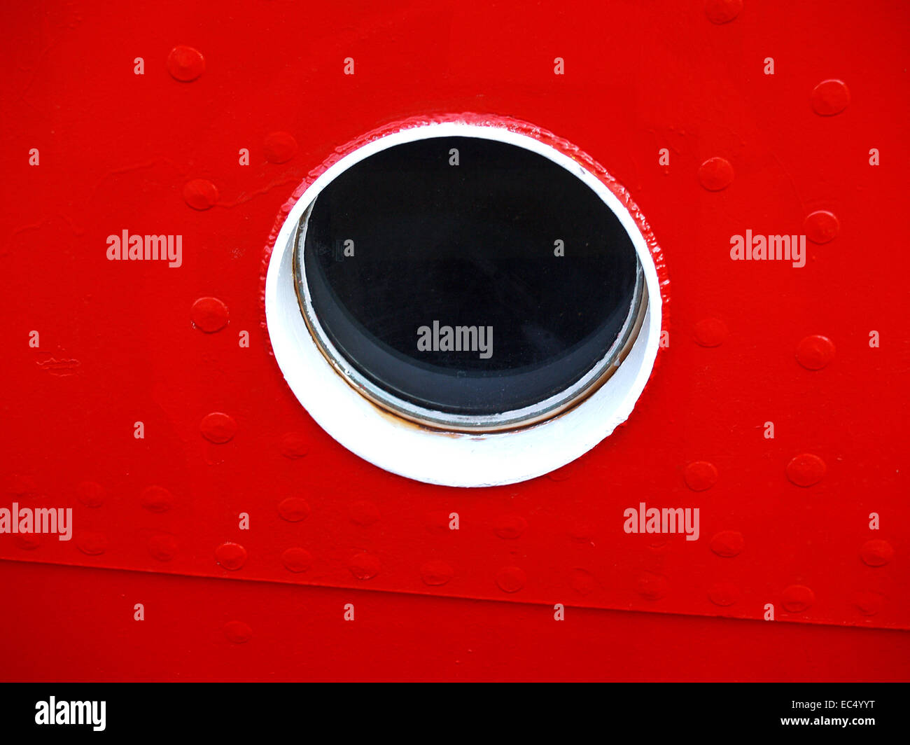 Red shell plate with porthole Stock Photo - Alamy