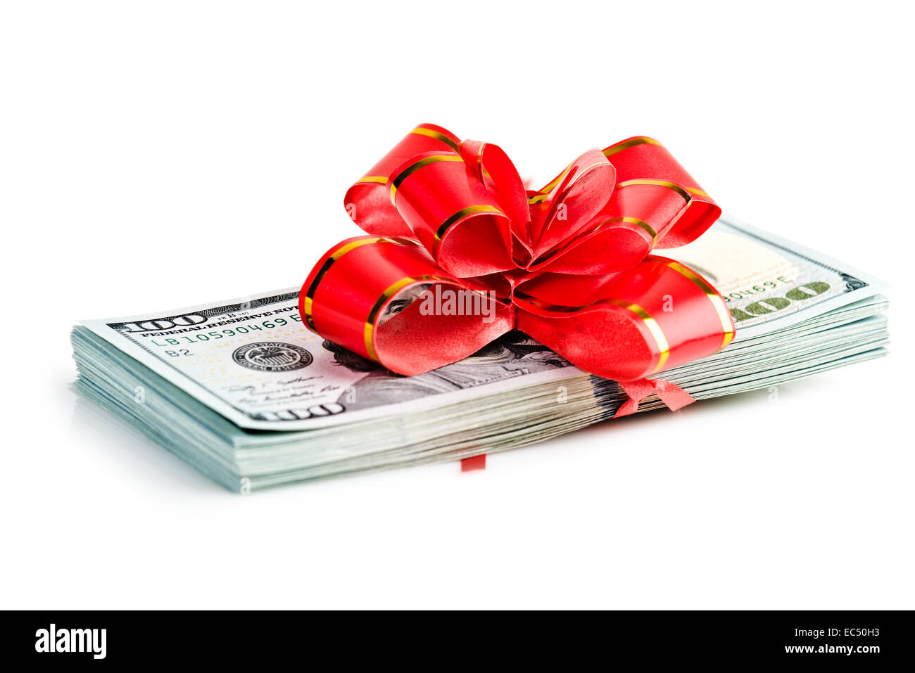 Money gift, big stack of dollars with red bow isolated on white ...