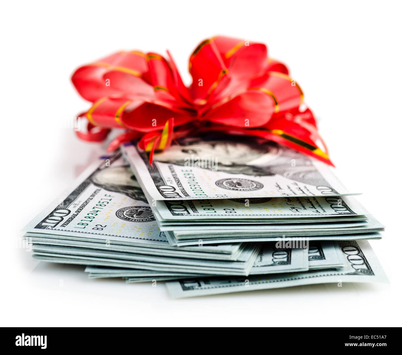 Money gift, big stack of dollars with red bow isolated on white ...