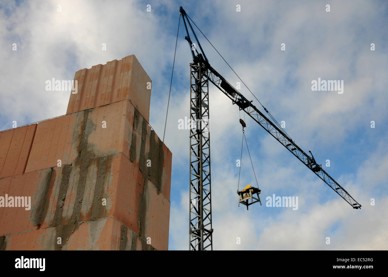 Crane lifting bricks hi-res stock photography and images - Alamy