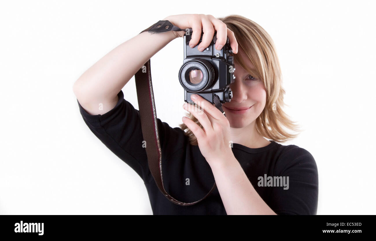 Blonde Woman with vintage SLR camera Stock Photo - Alamy
