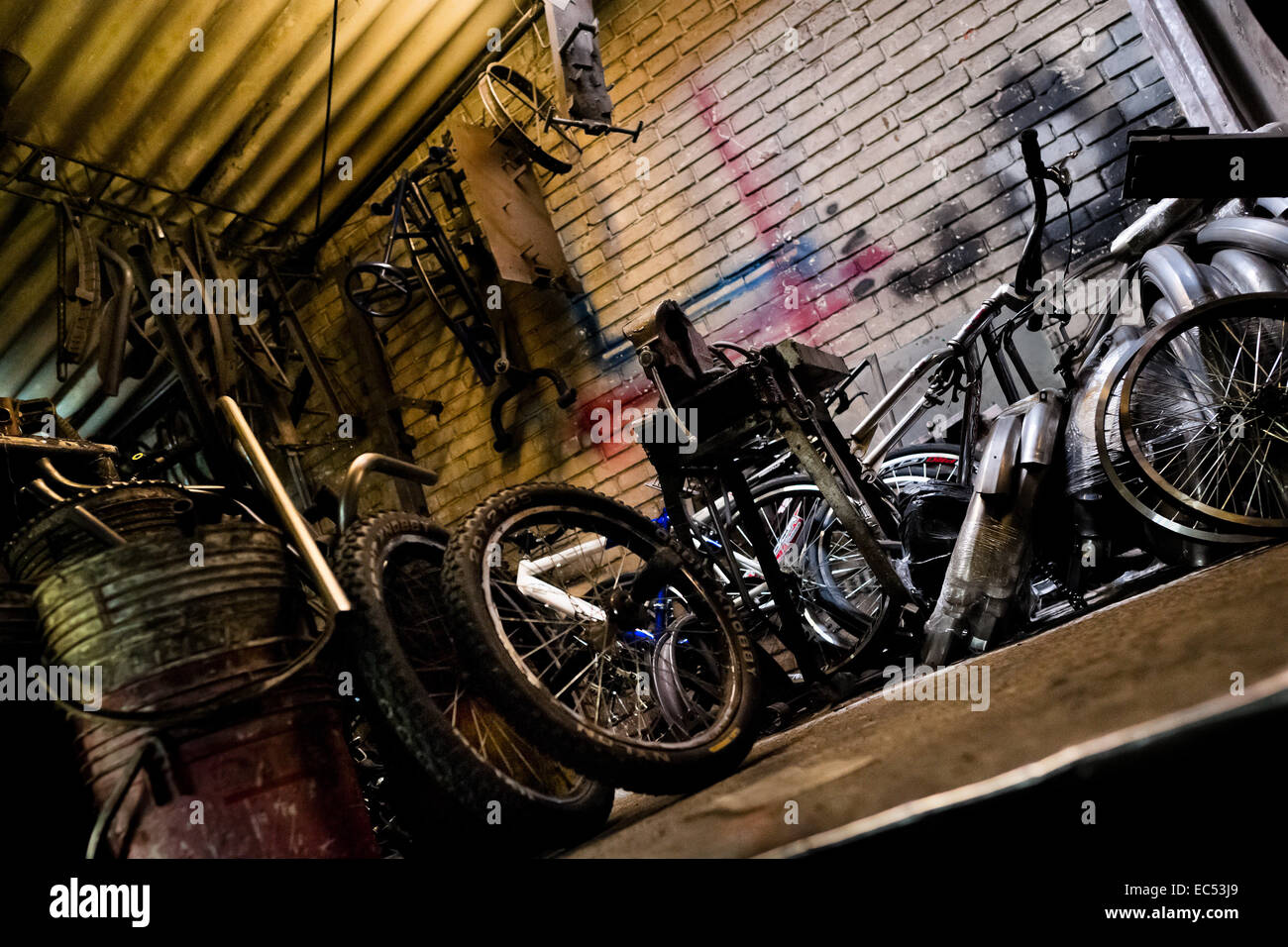 Bicycle components are seen inside a mechanic's workshop in a small ...