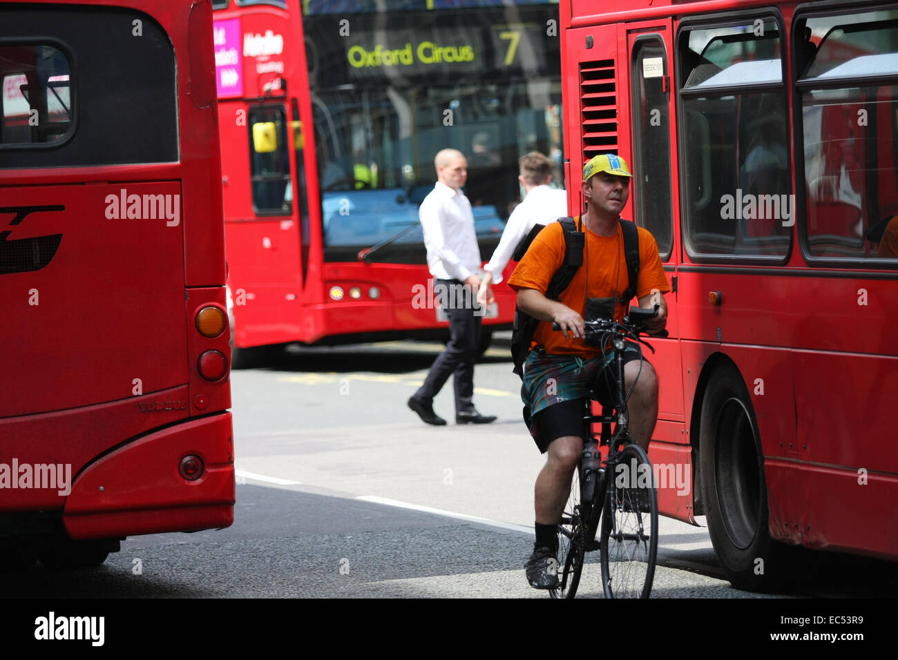 Buses, a cyclist and pedestrians in Oxford Street, London Stock Photo ...