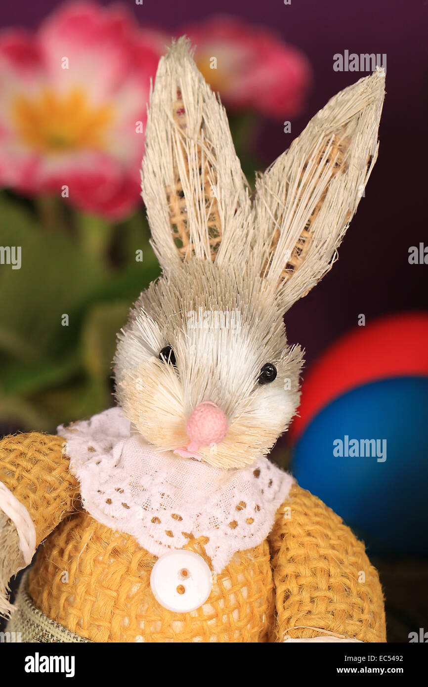 Cute easter bunny teddy bear or rabbit with flowers in background Stock ...