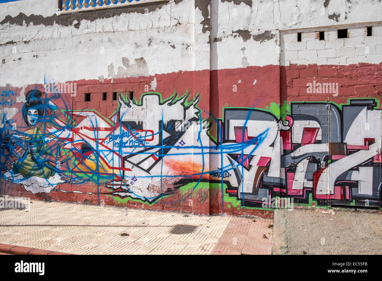 A wall with spray painted Graffiti Stock Photo - Alamy