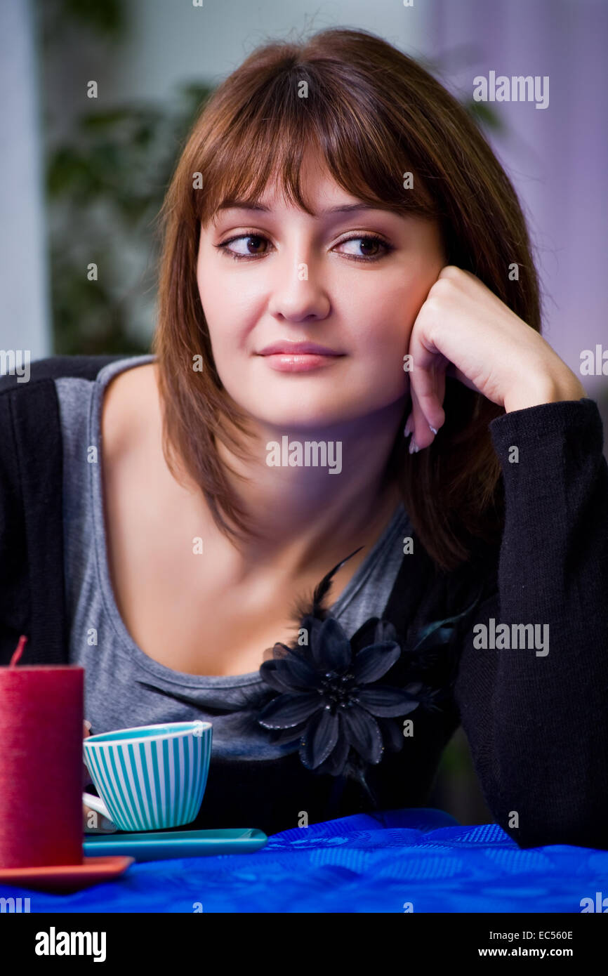 portrait of a young woman in front of black background Stock Photo - Alamy