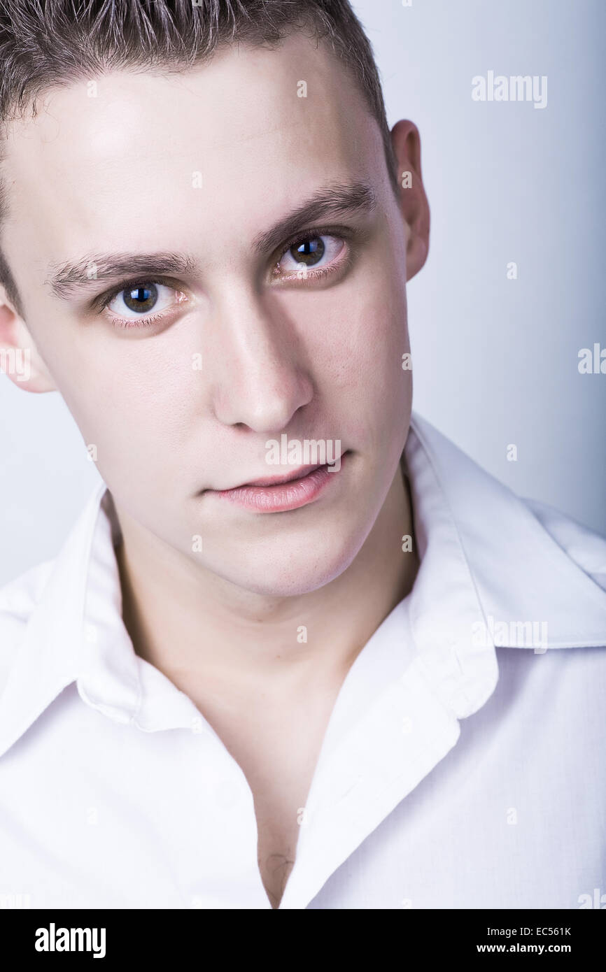 portrait of a young man in front of white background Stock Photo - Alamy