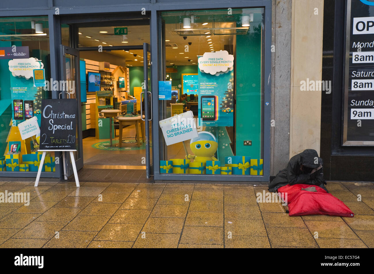 Homeless man outside shop hi-res stock photography and images - Alamy