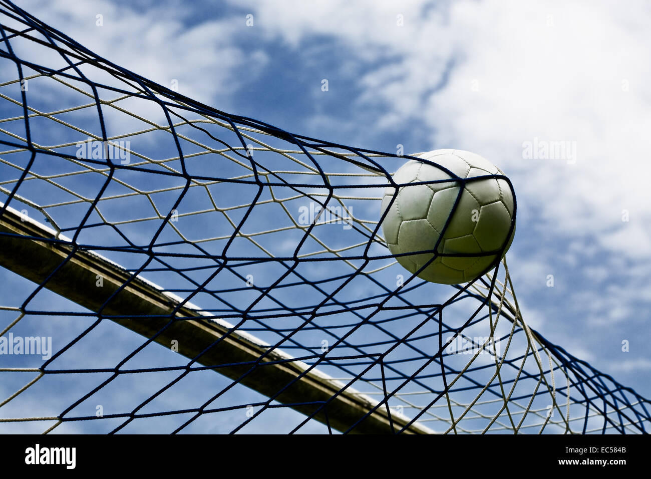 a soccer ball in the goal Stock Photo - Alamy