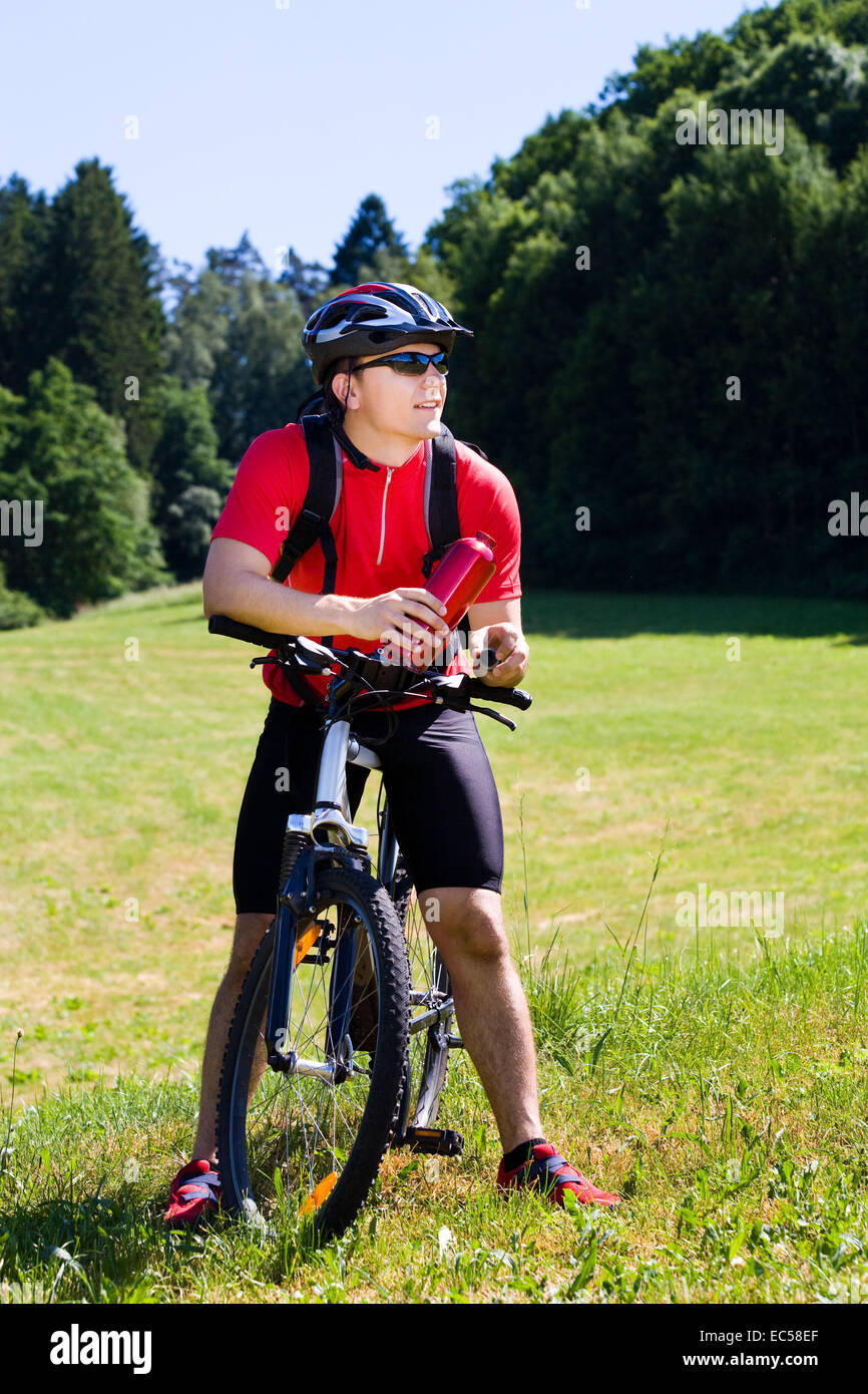 a biking man in front of nature scenes Stock Photo - Alamy