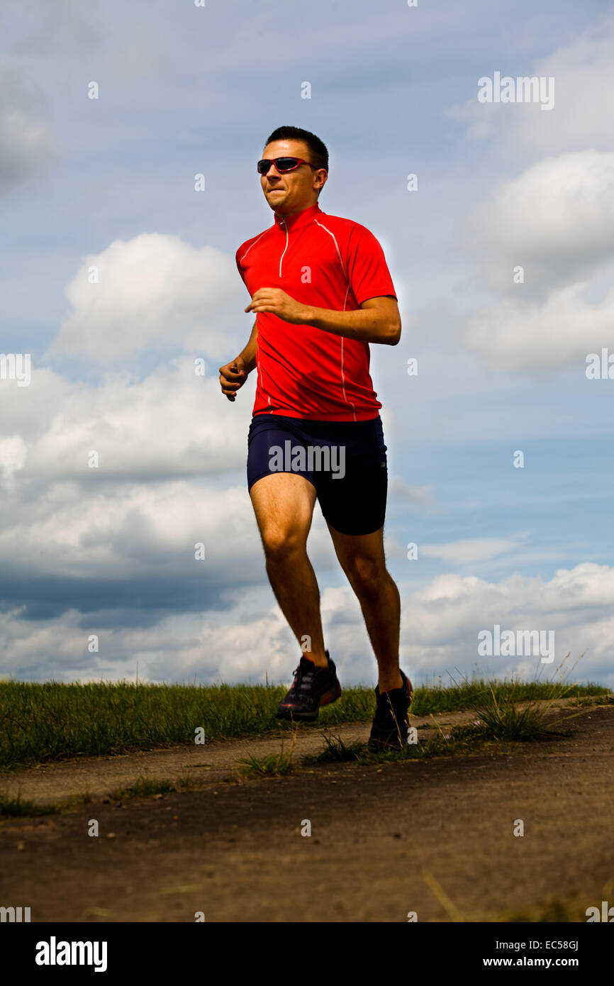 Adult man running cross hi-res stock photography and images - Alamy