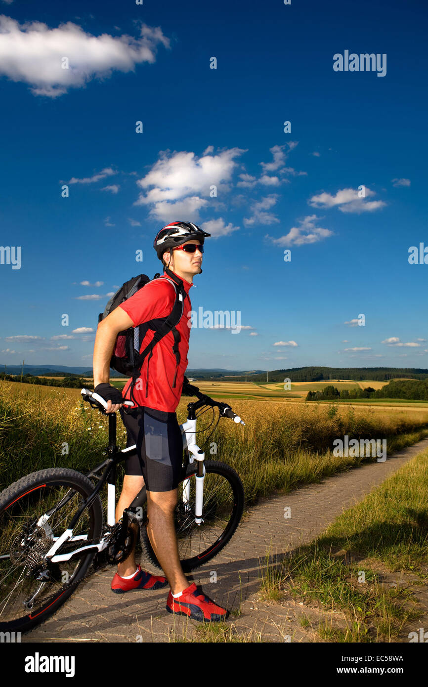 a biking man in front of nature scenes Stock Photo - Alamy
