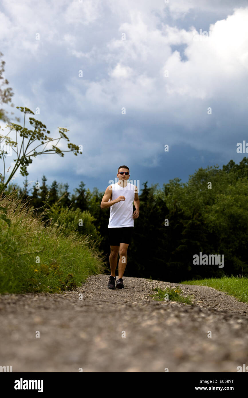man jogging through the fields Stock Photo - Alamy