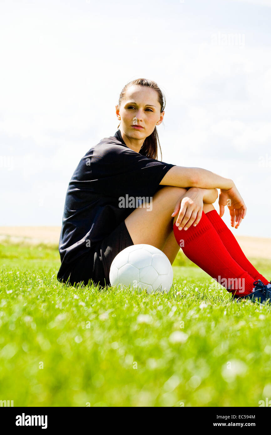 a young female football player on the field Stock Photo - Alamy