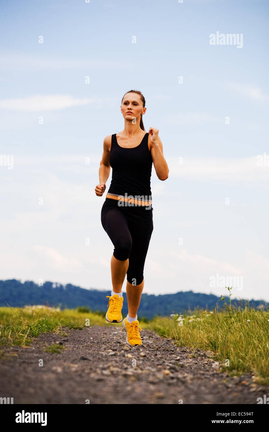 A woman jogging cross country Stock Photo - Alamy