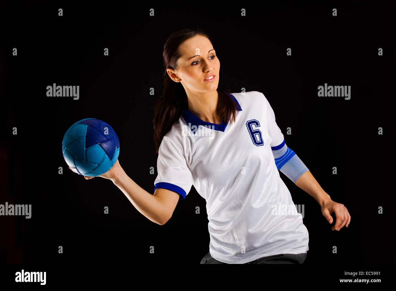 female handball player with a ball Stock Photo - Alamy