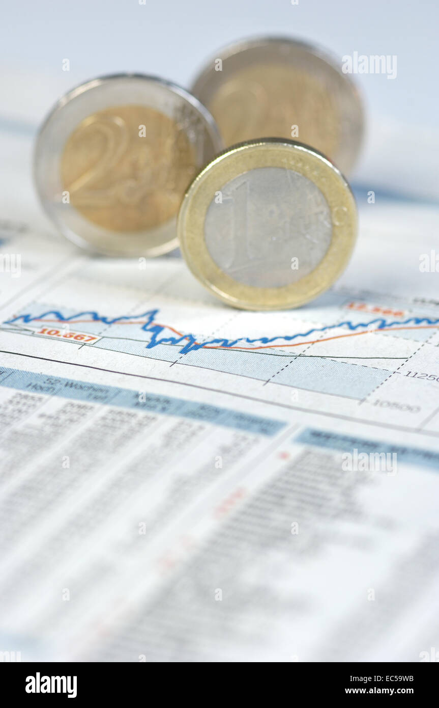 Euro coins on a chart Stock Photo - Alamy
