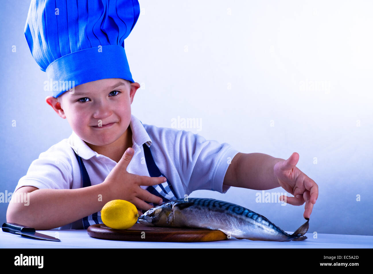 a 6 years old boy preparing a meal Stock Photo - Alamy