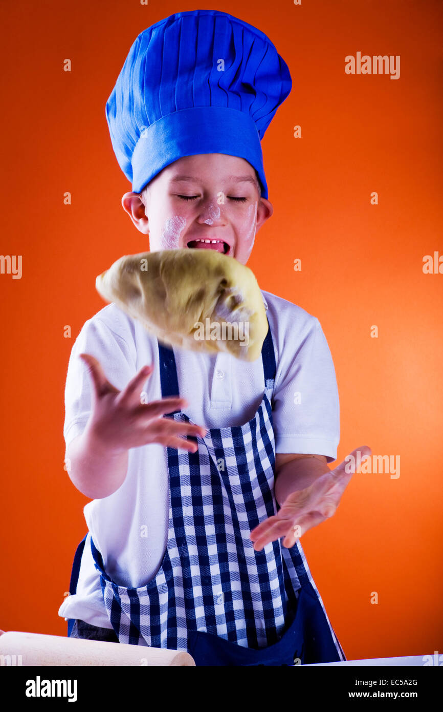 a 6 years old boy baking bread Stock Photo - Alamy