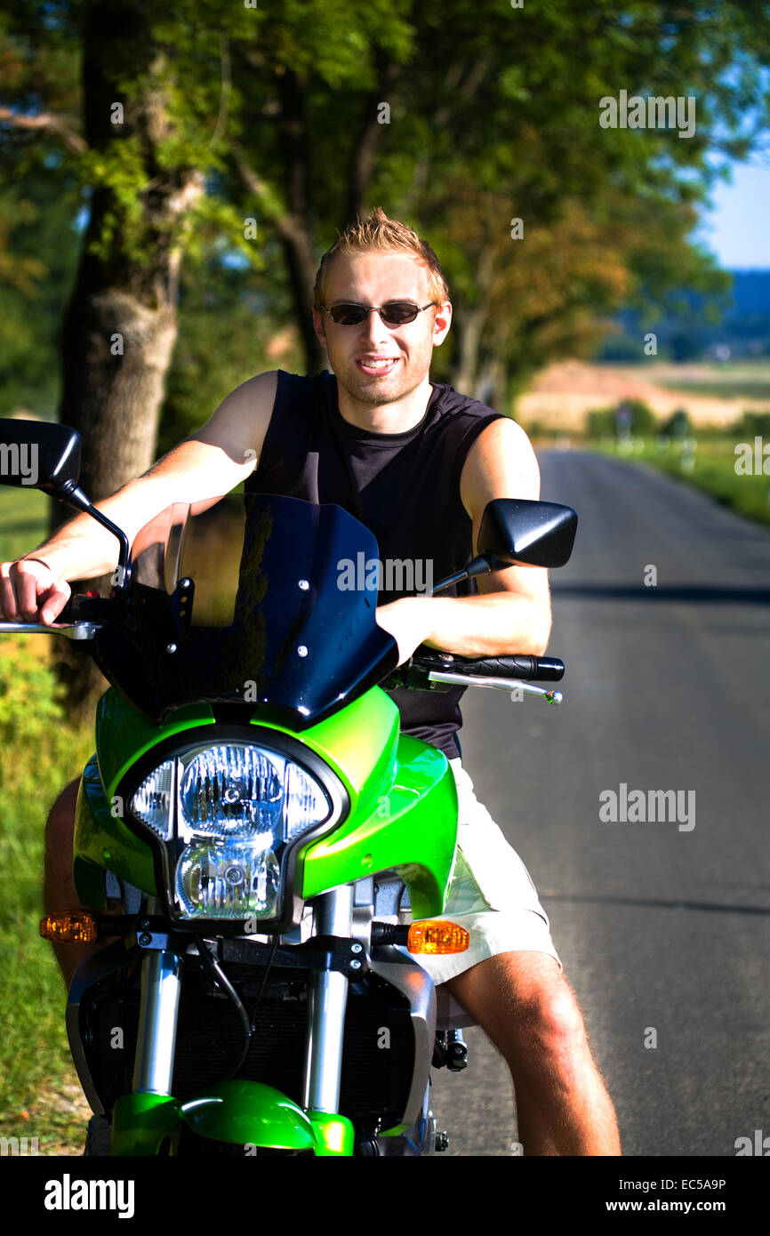 young man riding the motorcycle Stock Photo - Alamy