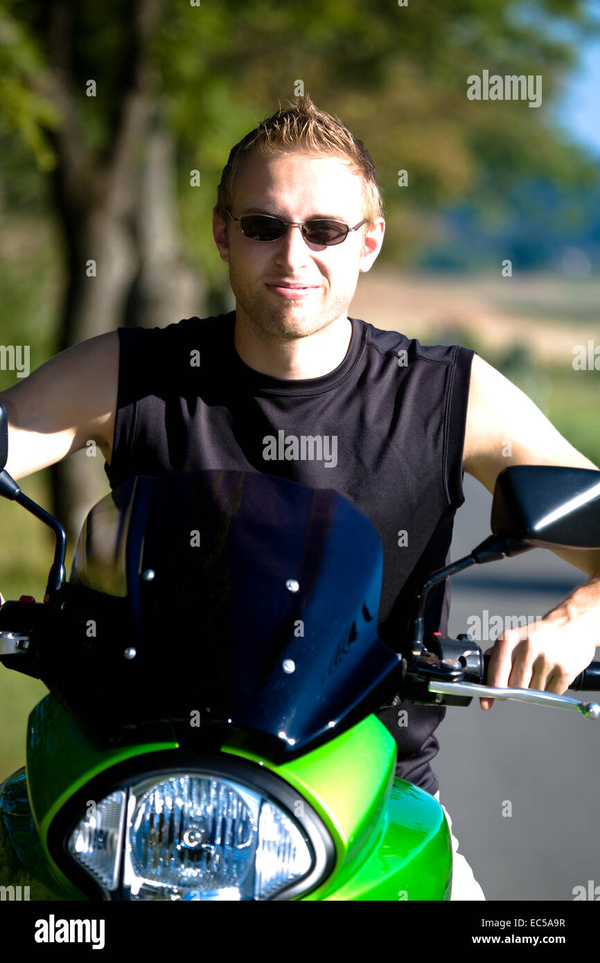 young man riding the motorcycle Stock Photo - Alamy