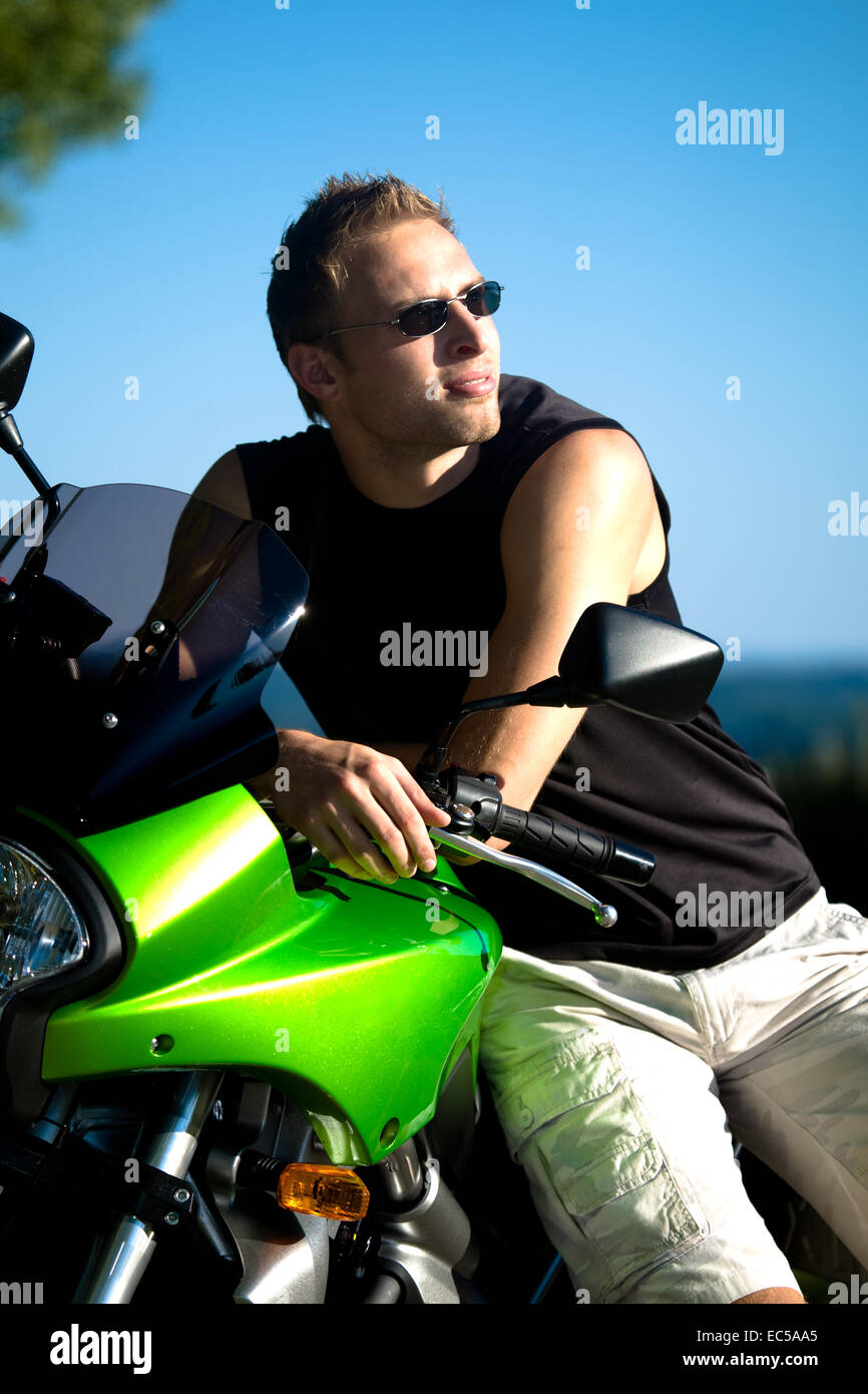 young man riding the motorcycle Stock Photo - Alamy