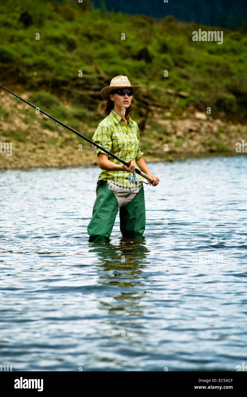 a female angler fishing in the river Stock Photo - Alamy