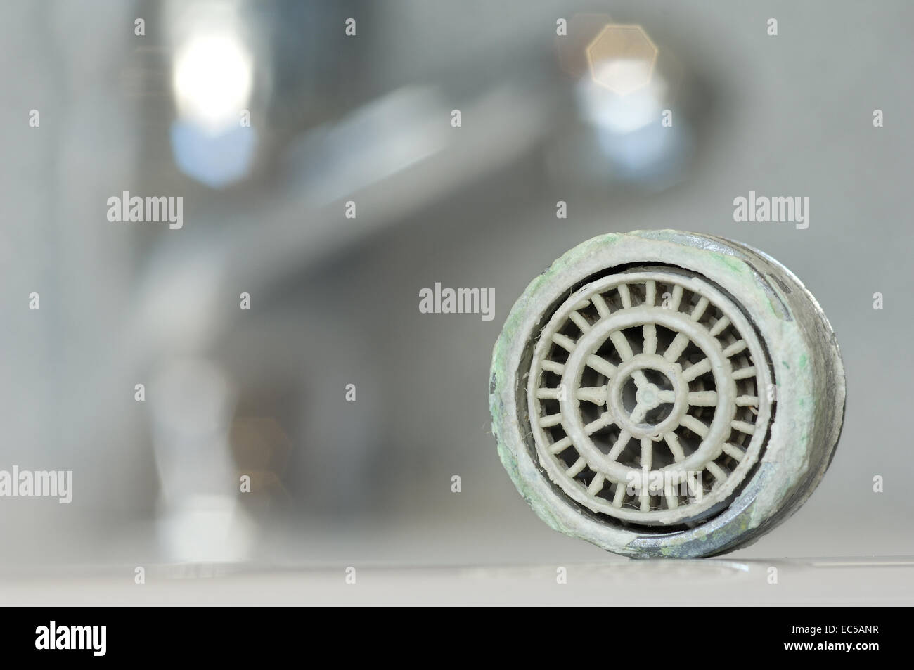 Calcified sieve of a faucet Stock Photo - Alamy