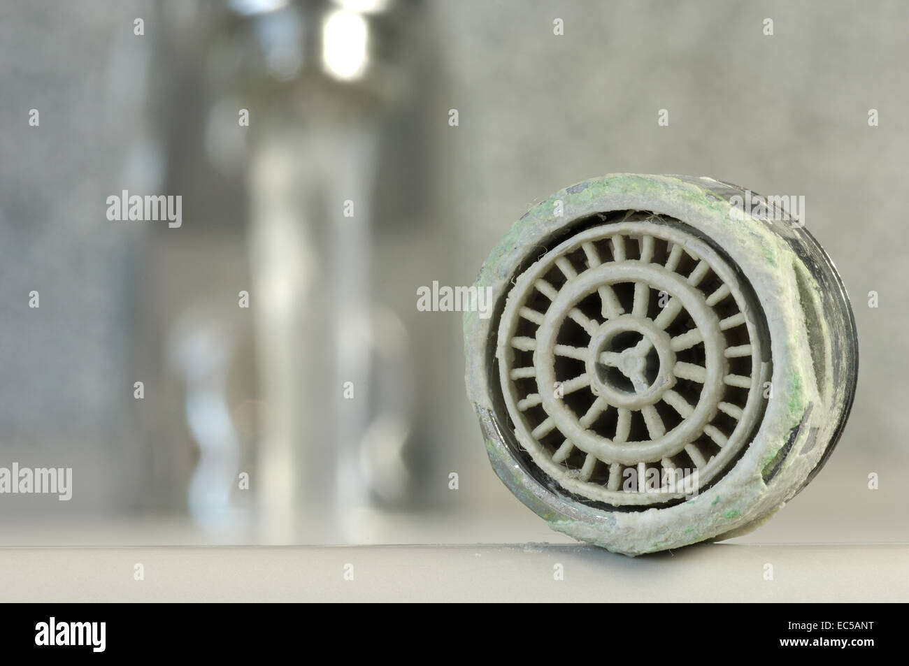 Calcified sieve of a faucet Stock Photo - Alamy