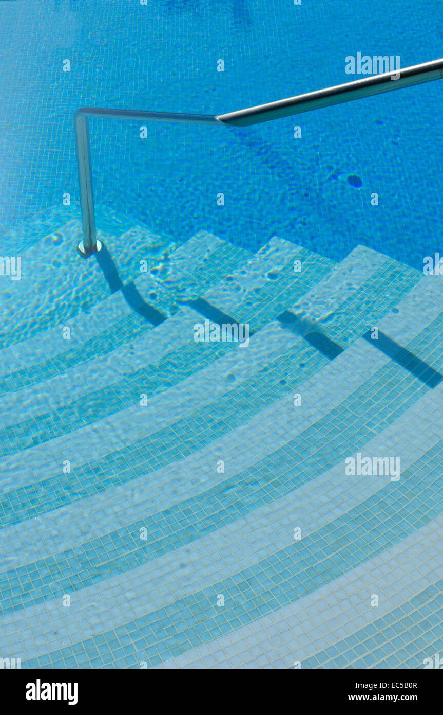 Stair and handrail into a swimming pool Stock Photo - Alamy