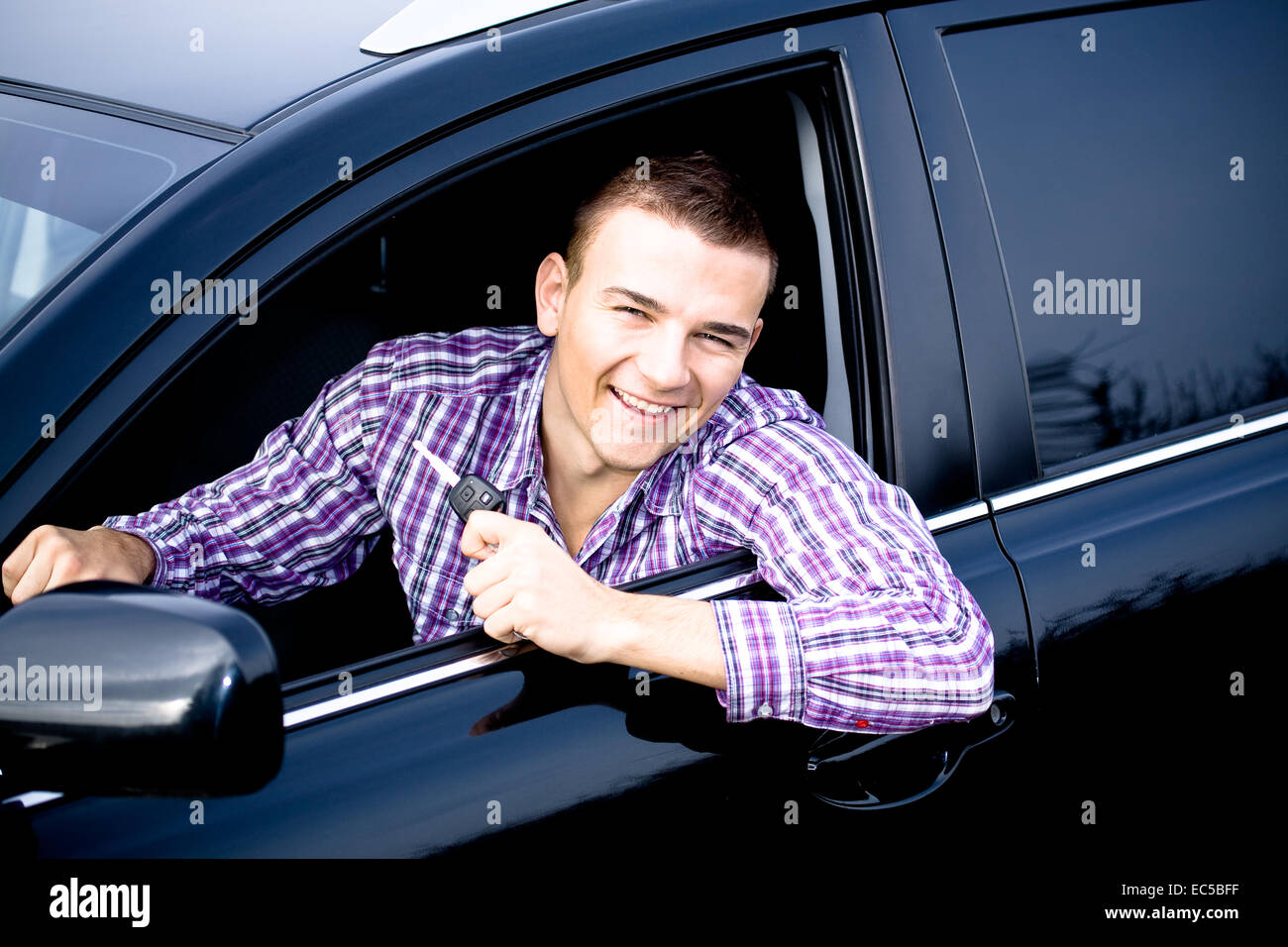 a young man driving the car Stock Photo - Alamy