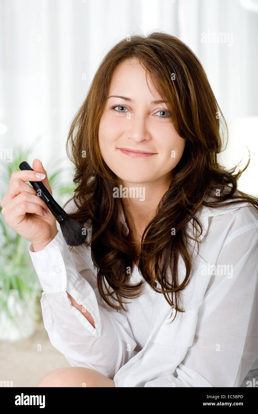 young woman making oneself up Stock Photo - Alamy