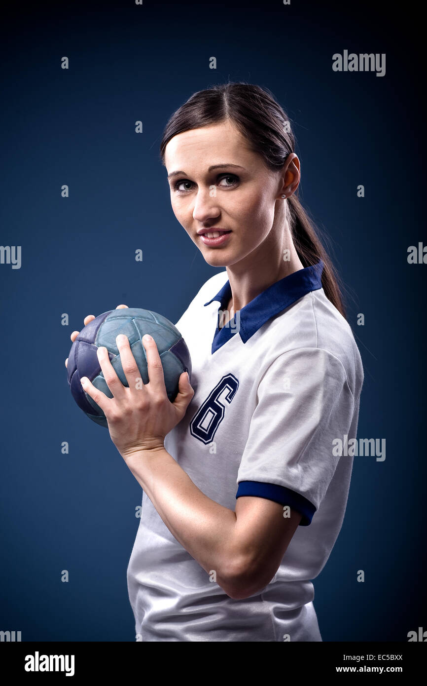 female handball player with a ball Stock Photo - Alamy