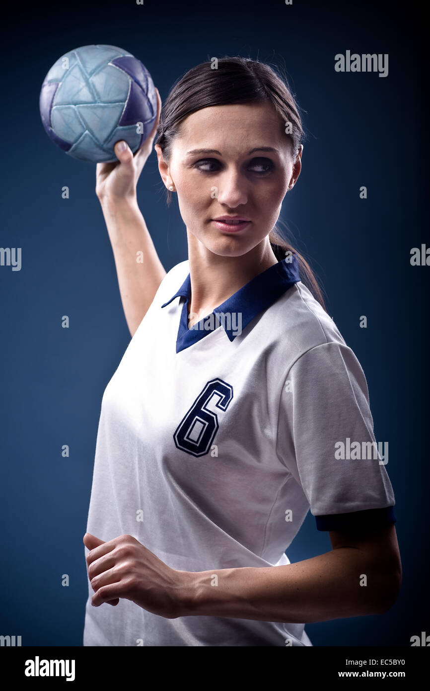 female handball player with a ball Stock Photo - Alamy