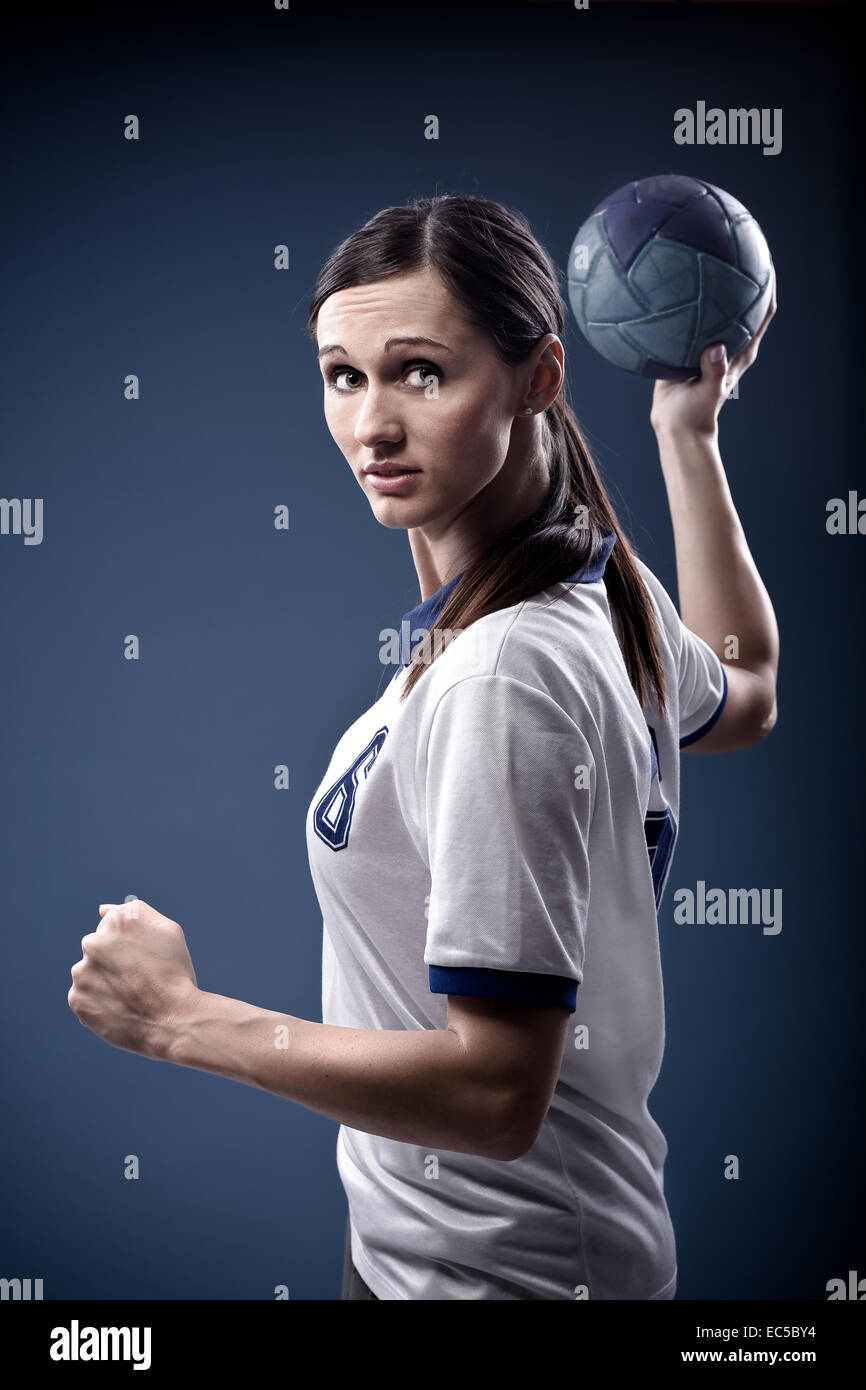 female handball player with a ball Stock Photo - Alamy