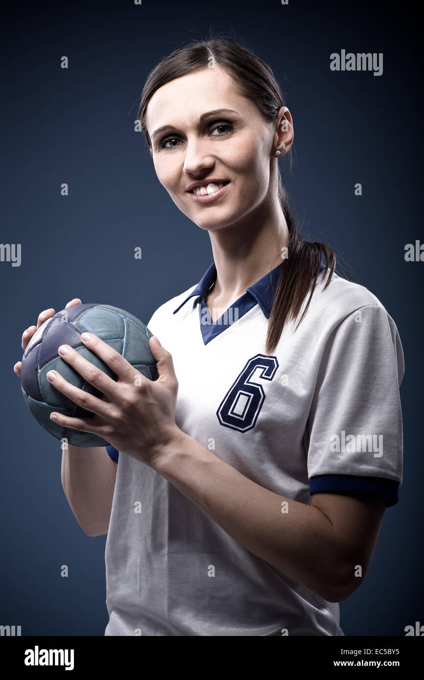 female handball player with a ball Stock Photo - Alamy