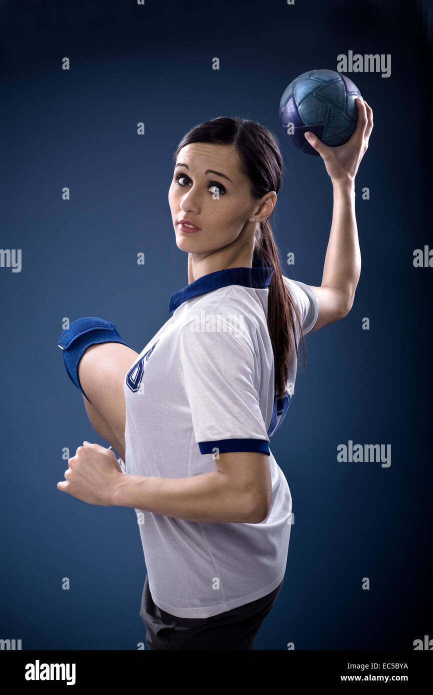 female handball player with a ball Stock Photo - Alamy